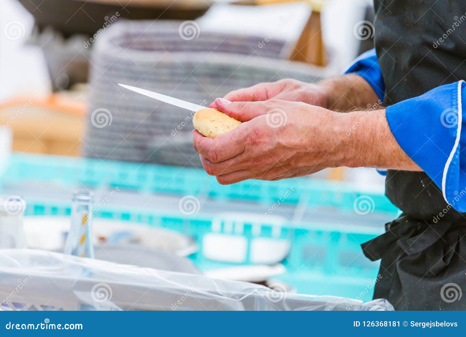Chef Cutting Fresh Bread for Burger Stock Image - Image of chef, baker ...