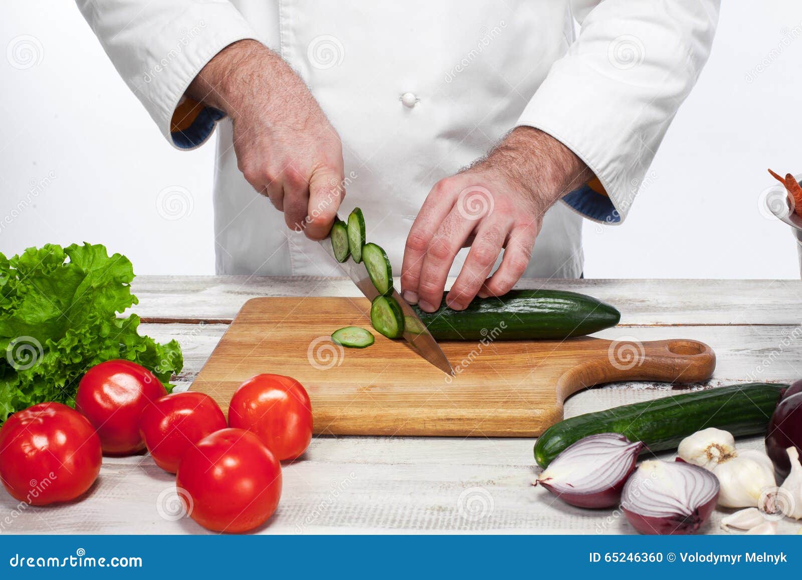 Chef Cutting a Green Cucumber in His Kitchen Stock Photo - Image of ...