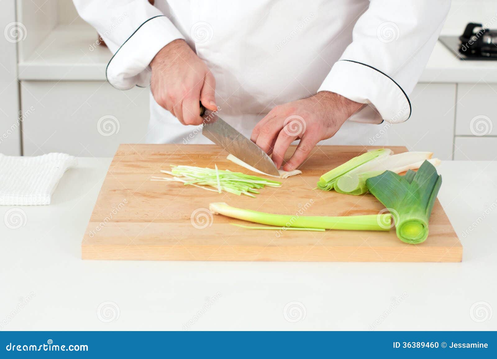 Chef cutting leek stock photo. Image of professional - 36389460