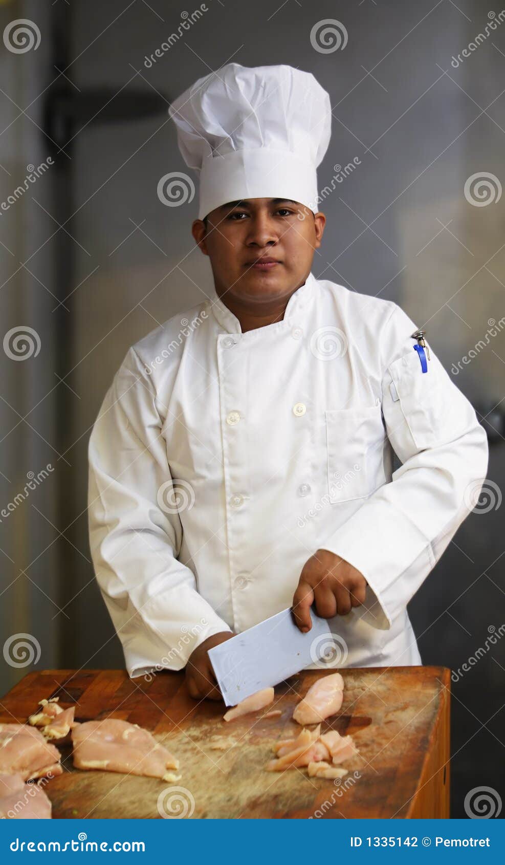 Chef Cutting Meat 2 stock photo. Image of clothing, kitchen - 1335142