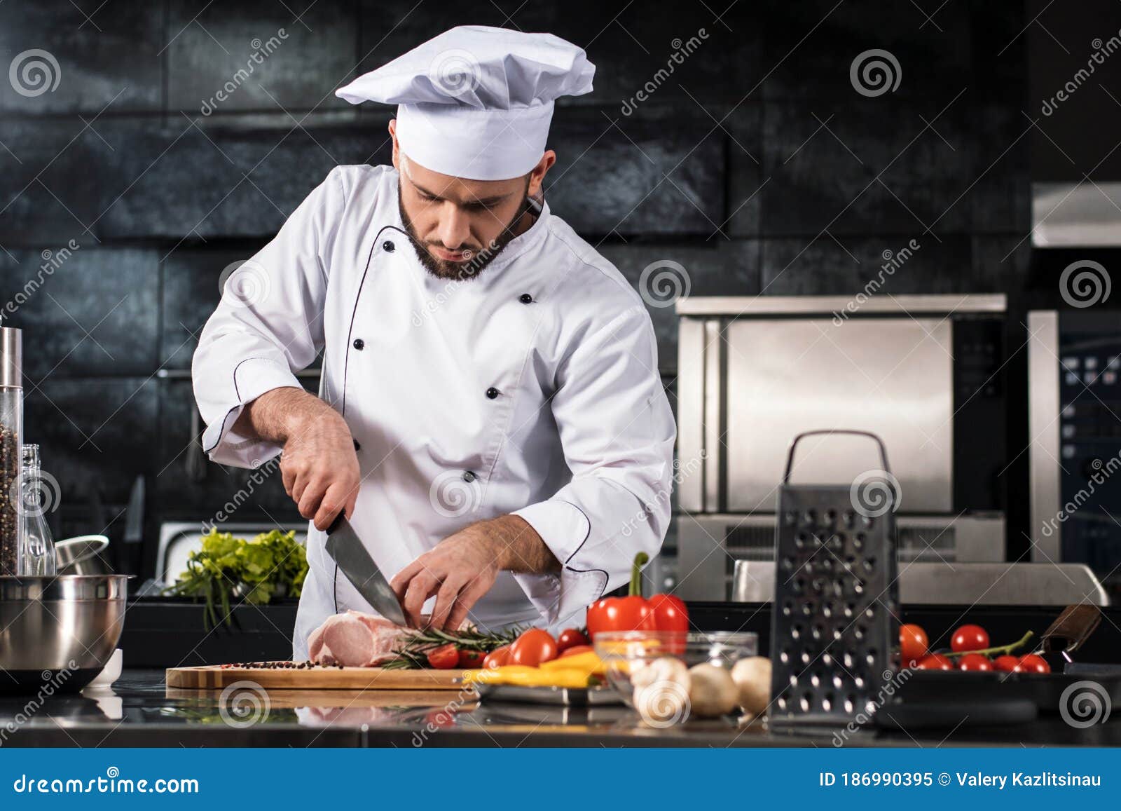 Chef Cutting Meat at Kitchen. Chef in Uniform Cut Beef at Planked Stock ...
