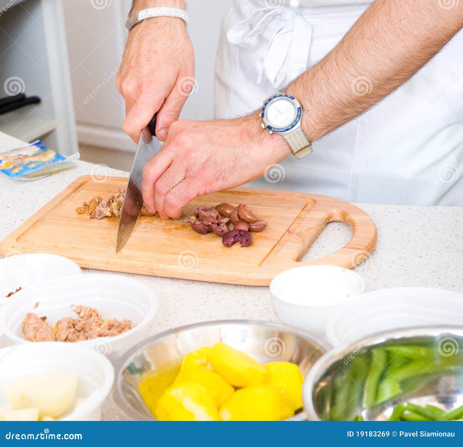 Chef cutting the olives stock image. Image of nutrition - 19183269