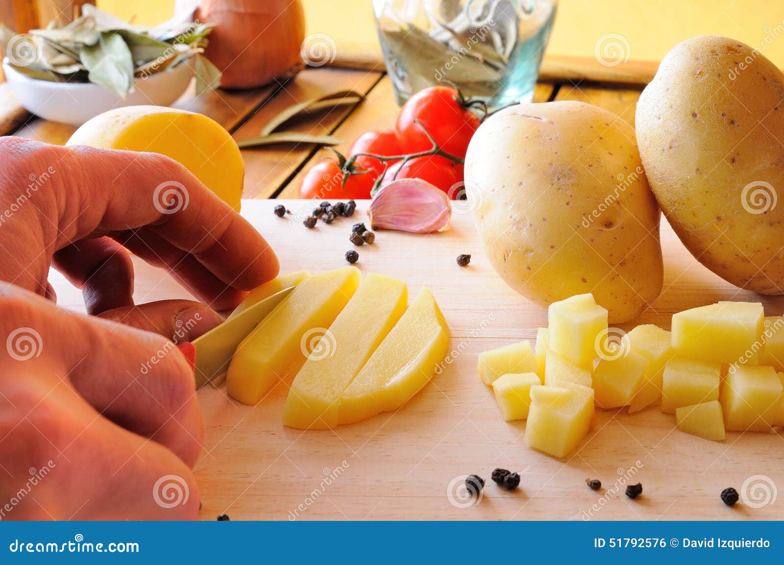 Chef Cutting Potatoes on a Cutting Board in the Kitchen Stock Photo ...