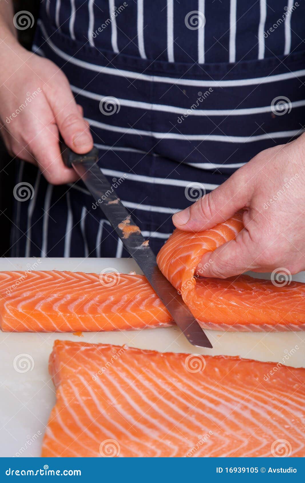 Chef cutting salmon fish stock image. Image of person - 16939105