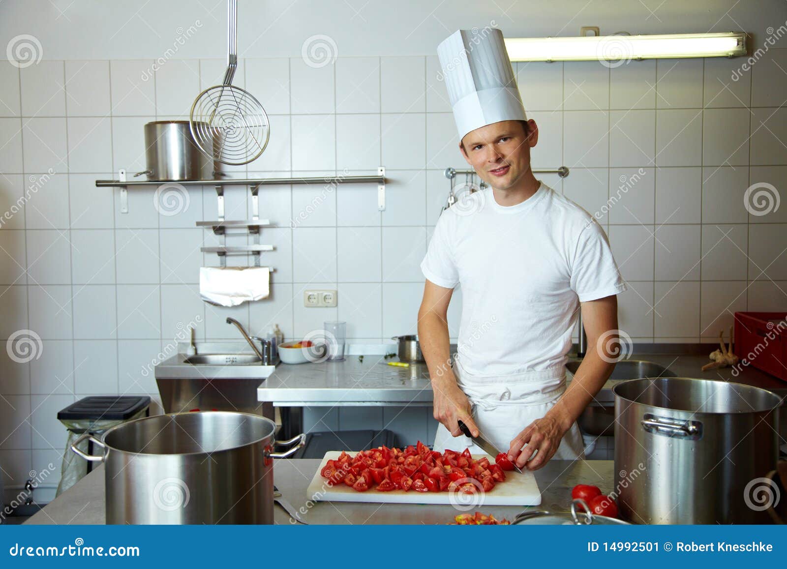 Chef cutting tomatoes stock image. Image of coat, shot - 14992501