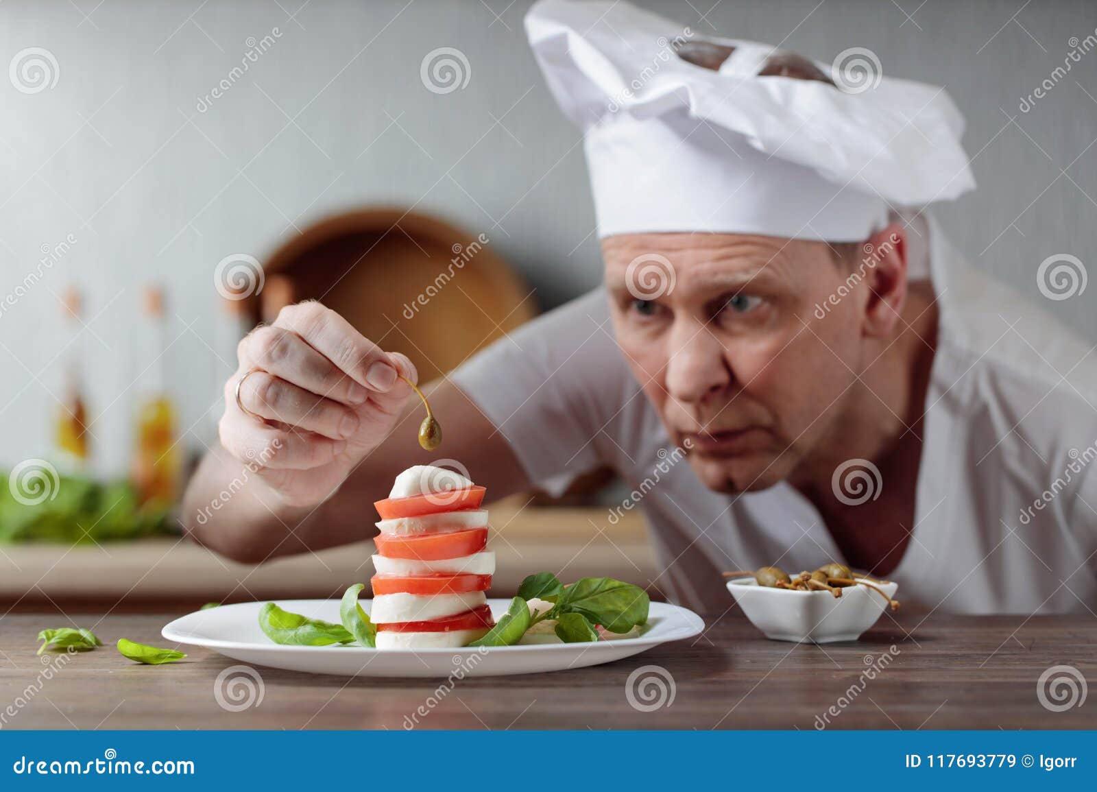 Chef Decorates Snacks with Mozzarella and Capers . Stock Image - Image ...