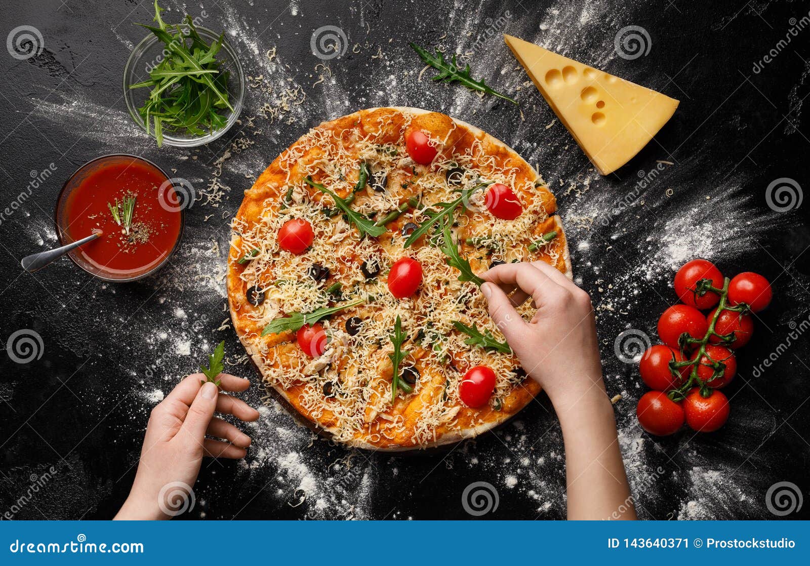 Chef Decorating Pizza with Rocket Salad and Cherry Tomatoes Stock Image ...