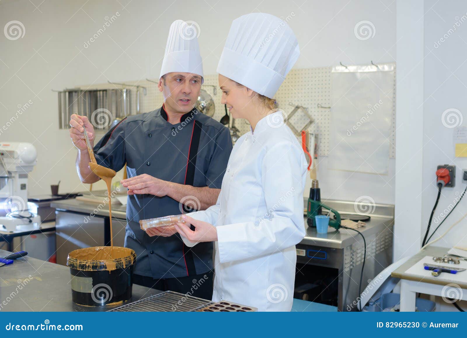 Chef Discussing with Commis Chef Stock Photo - Image of profession ...