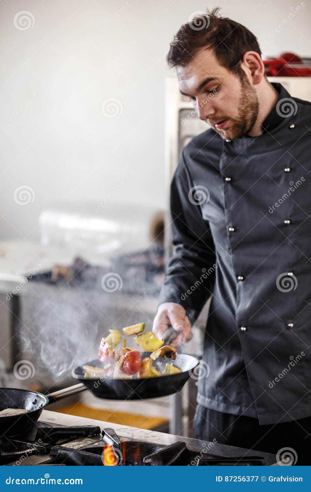 Chef flipping vegetables stock image. Image of preparing - 87256377