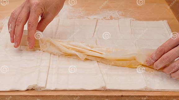 Chef Folding Buttered Layers of Phyllo Dough into Rolls Stock Photo ...