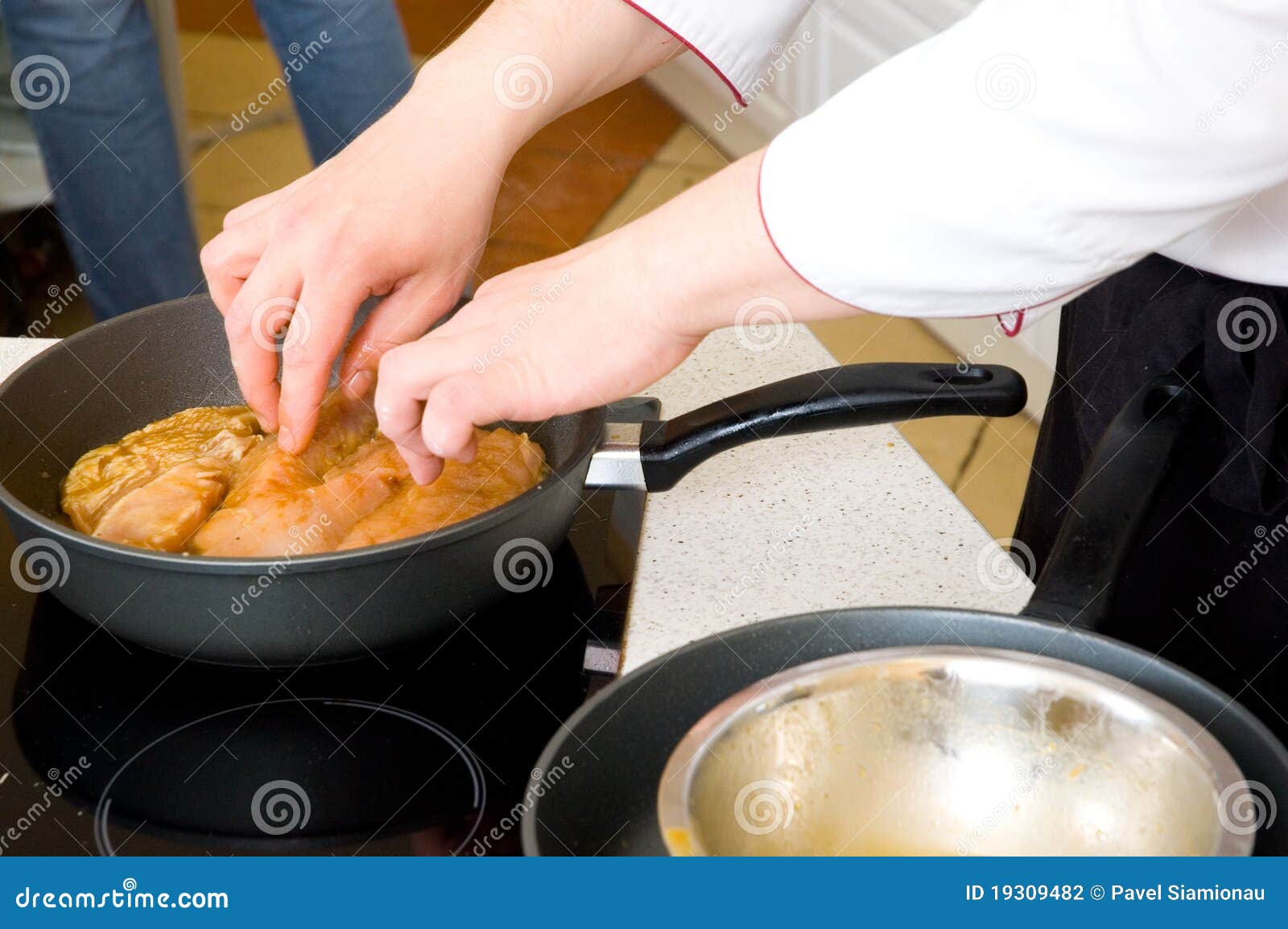 Chef frying chicken fillet stock photo. Image of life - 19309482
