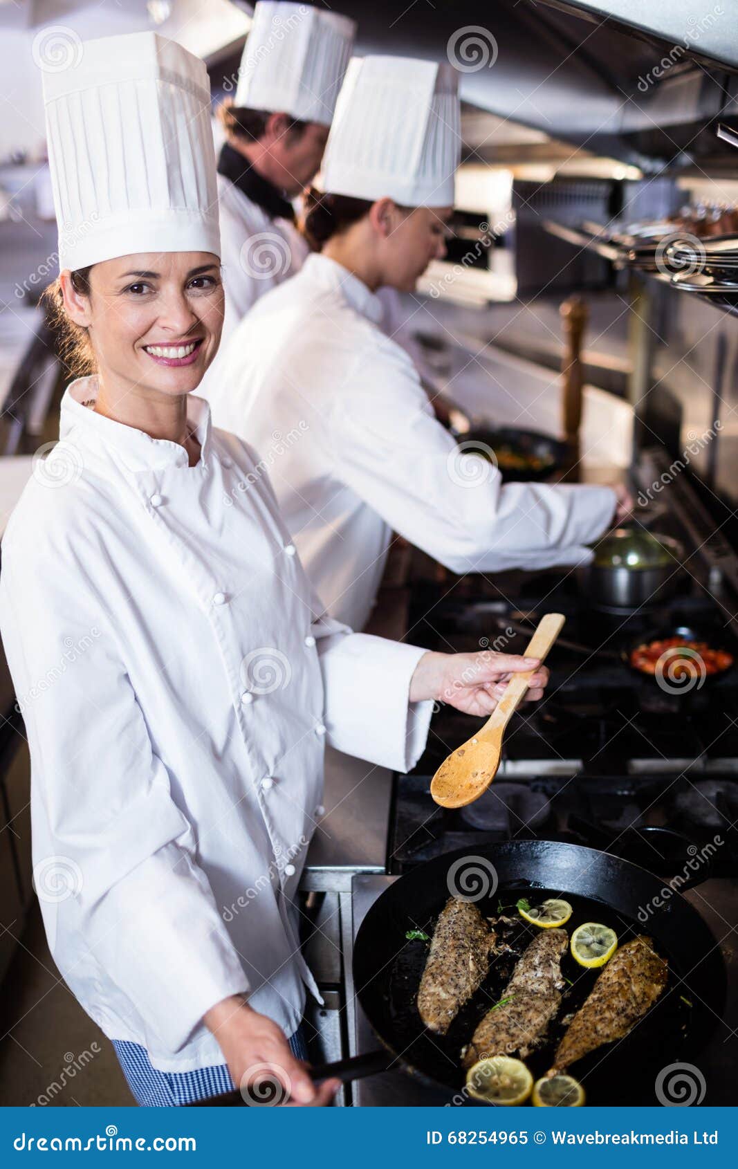 Chef Frying Fish in a Frying Pan Stock Image - Image of mature, holding ...