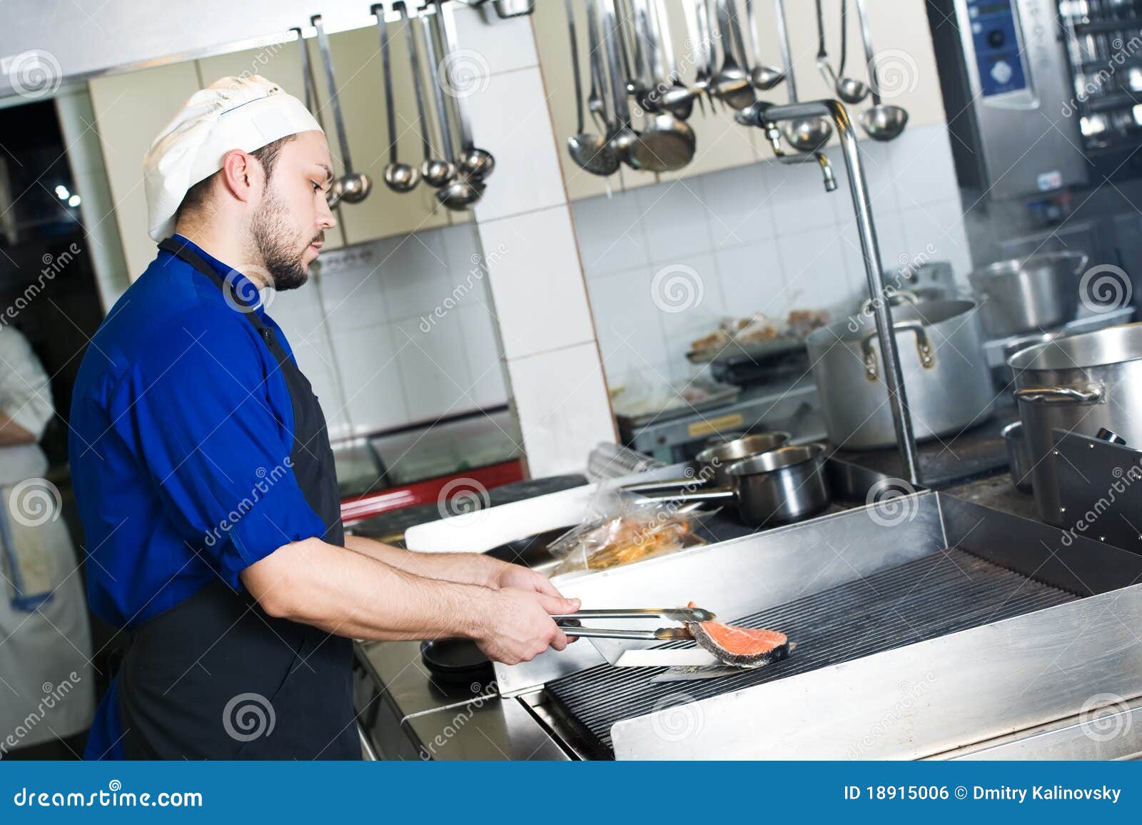 Chef Frying a Fish on Grill Stock Photo - Image of cooking, frying ...