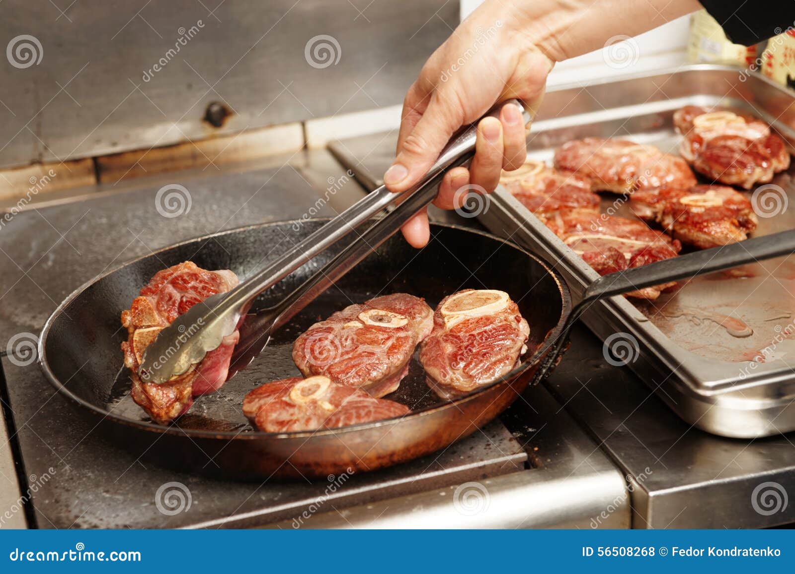 Chef is frying meat stock photo. Image of cooking, stainless - 56508268