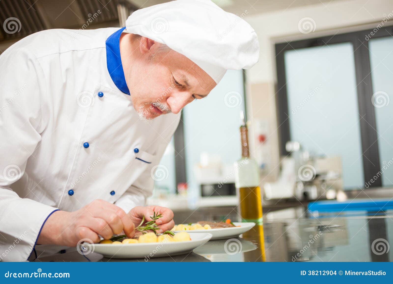 Chef garnishing a dish stock photo. Image of kitchen - 38212904