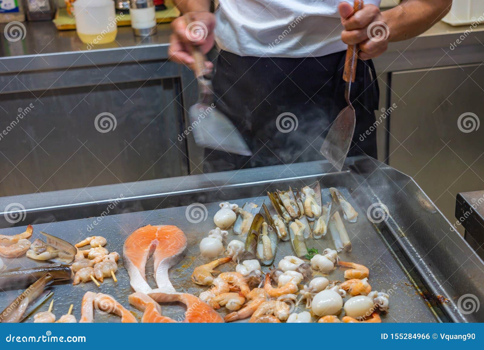 The Chef Grilling Assortment of Seafood in Restaurant`s Kitchen Stock ...
