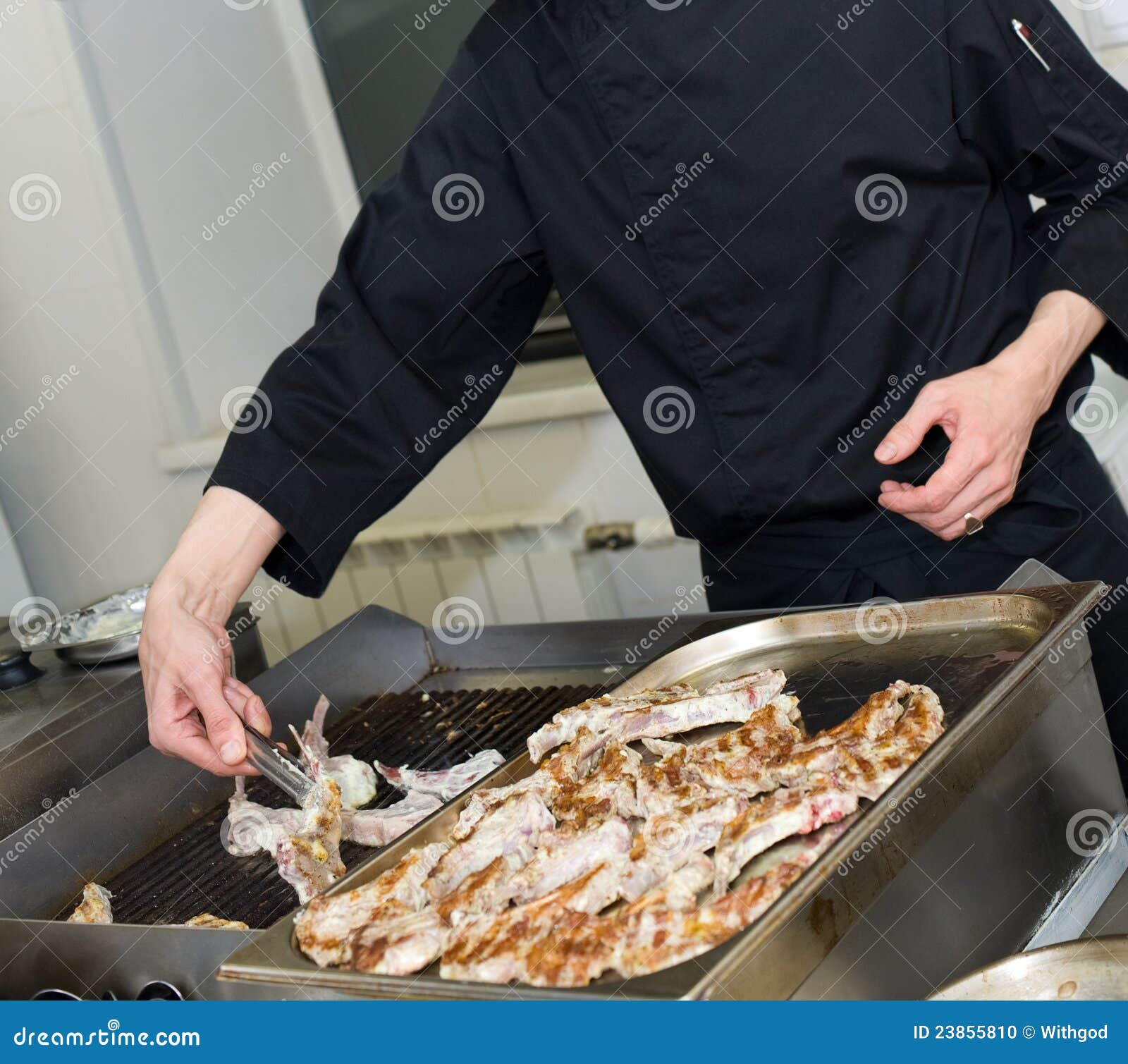 Chef grills meat stock photo. Image of browned, indoors - 23855810