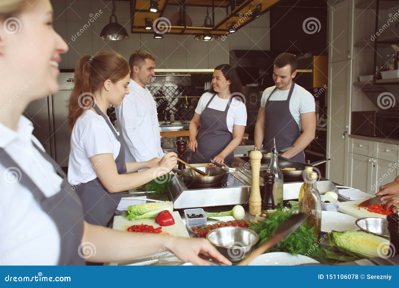 Chef and Group of Young People during Cooking Classes Stock Photo ...