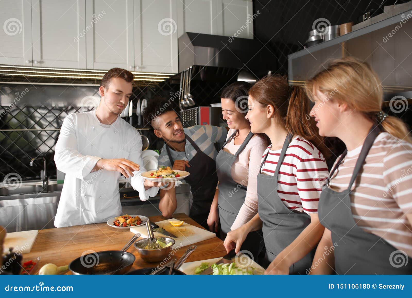 Chef and Group of Young People during Cooking Classes Stock Photo ...