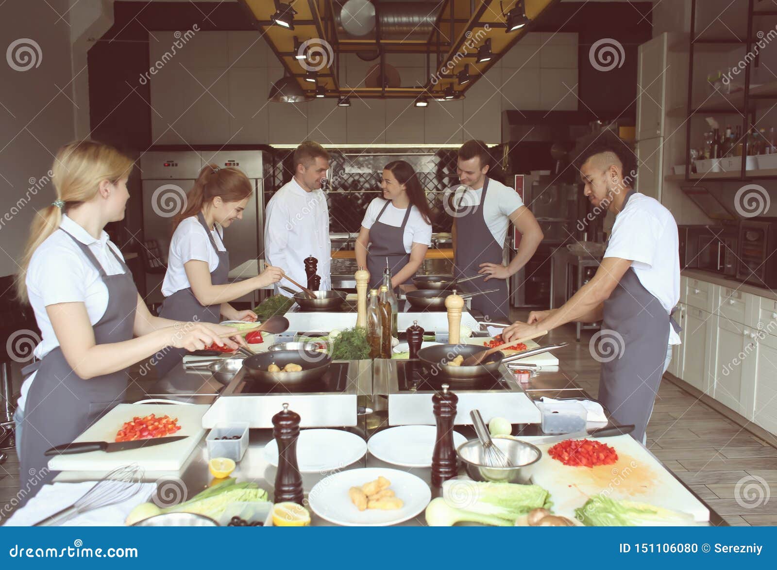 Chef and Group of Young People during Cooking Classes Stock Photo ...