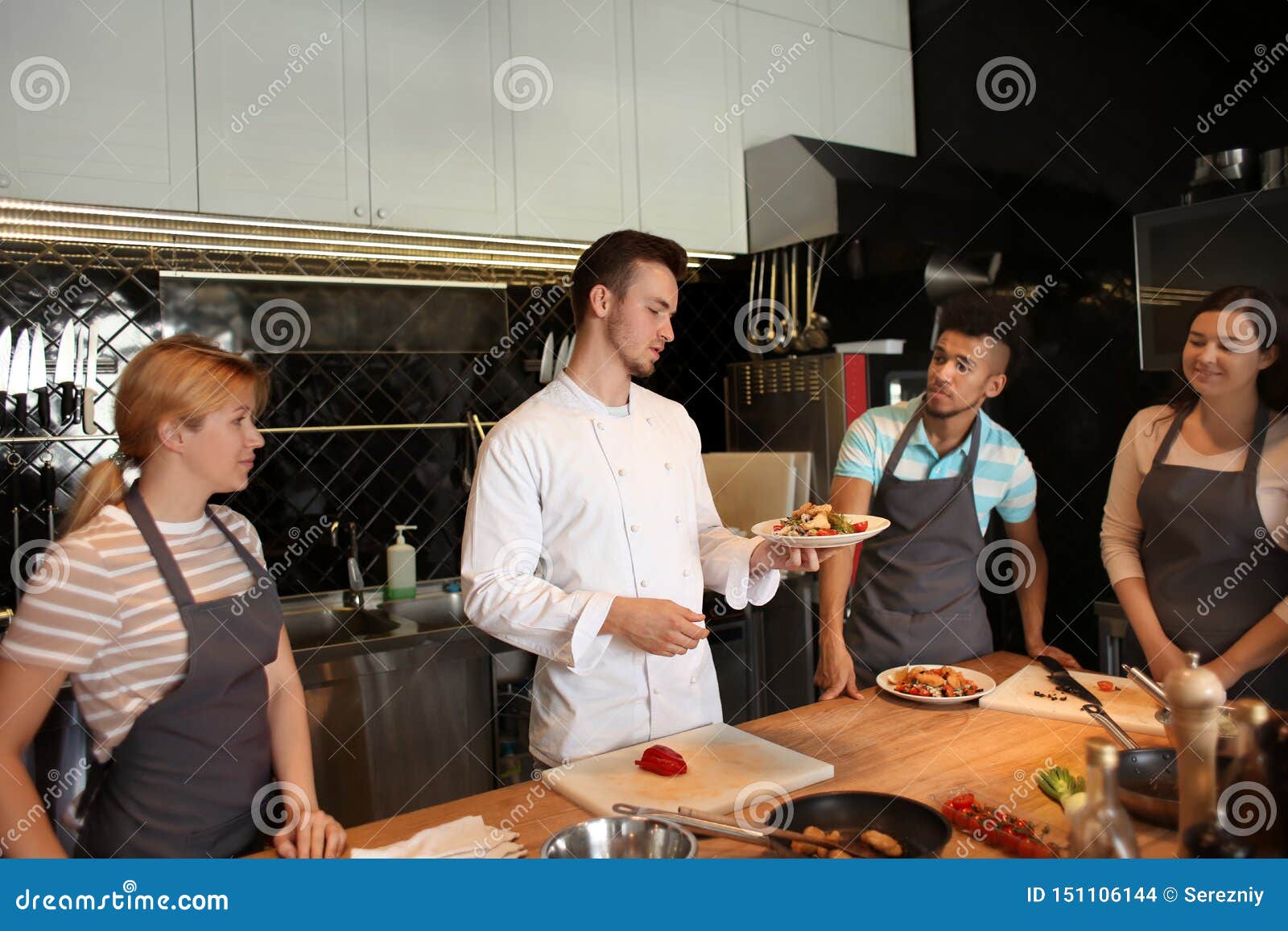 Chef and Group of Young People during Cooking Classes Stock Photo ...