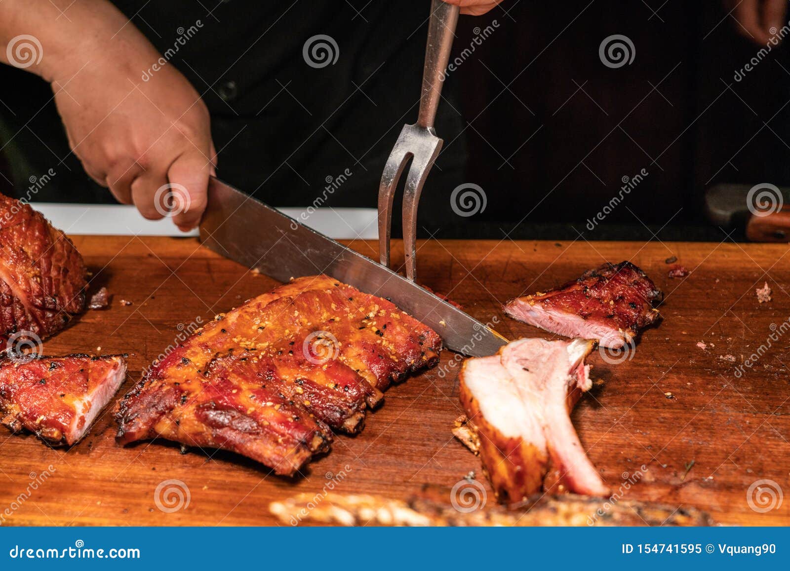 Chef Hand Cutting Grilled Ribs by Sharp Knife and Fork Stock Image ...