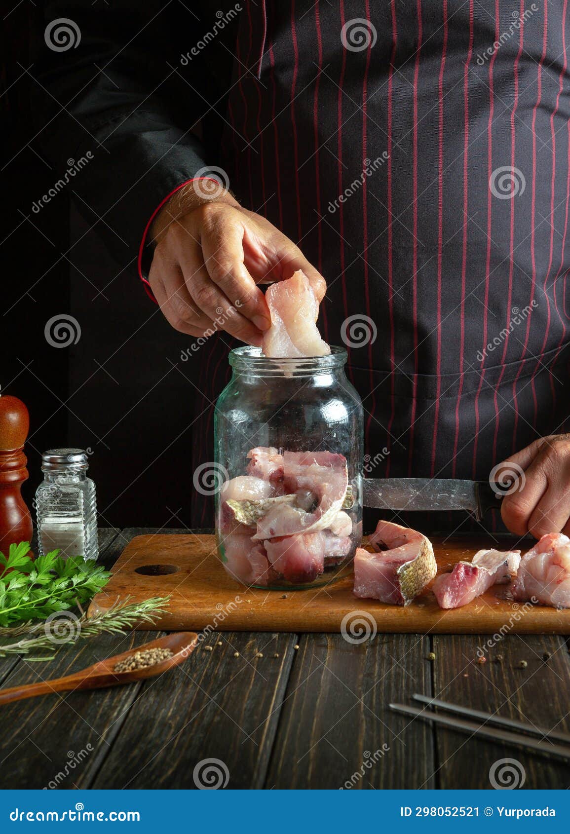 Chef Hand Puts Fish Steak in a Jar for Marinating with Salt and Spices ...