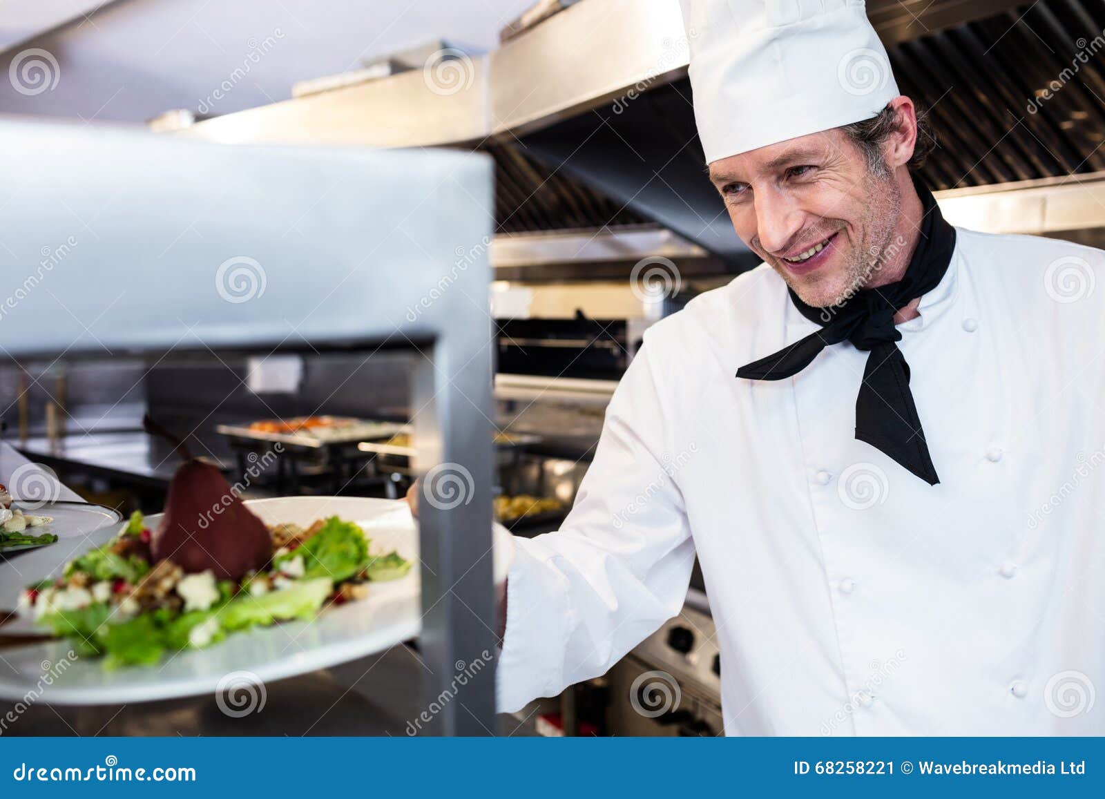 Chef Handing Dinner Plate through Order Station Stock Image - Image of ...