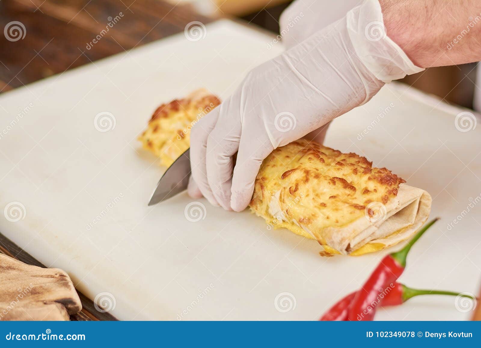 Chef Hands Cutting Burrito on Pieces. Stock Photo - Image of burrito ...