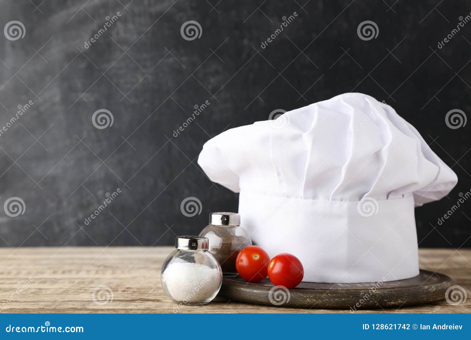 Chef Hat with Salt, Pepper and Tomato Stock Photo - Image of glass ...