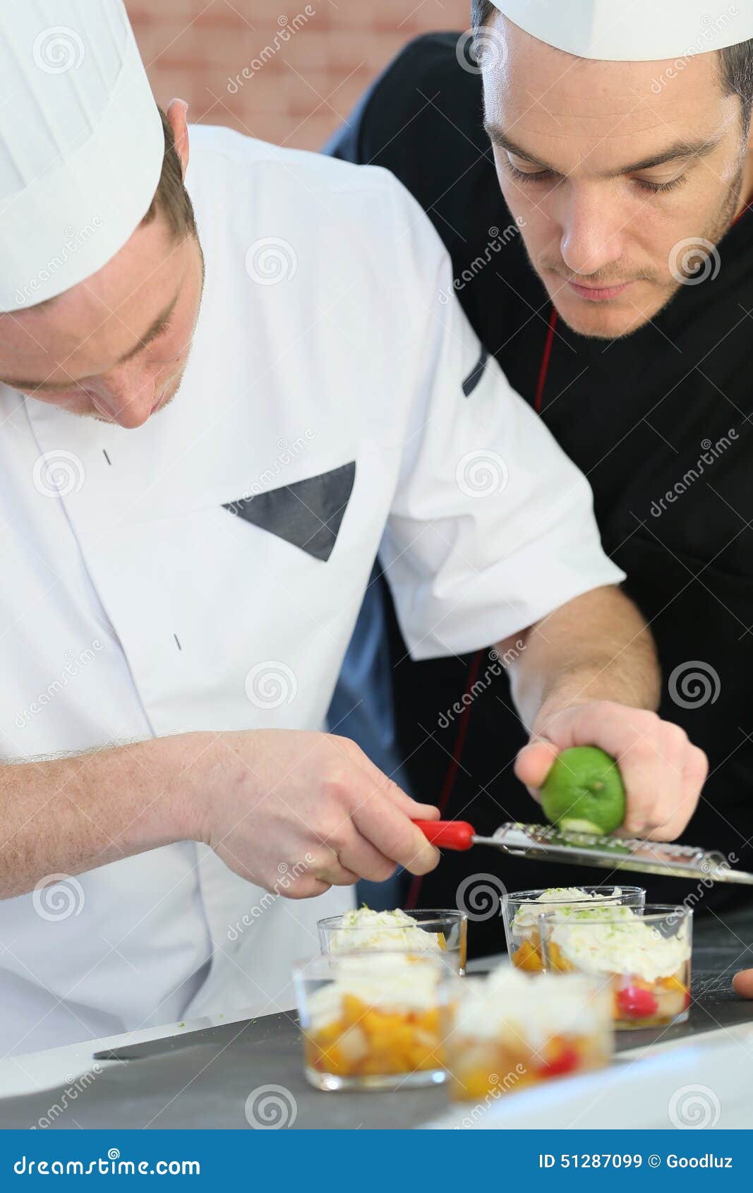 Chef Helping Young Cook To Preparing Dessert Stock Image - Image of ...