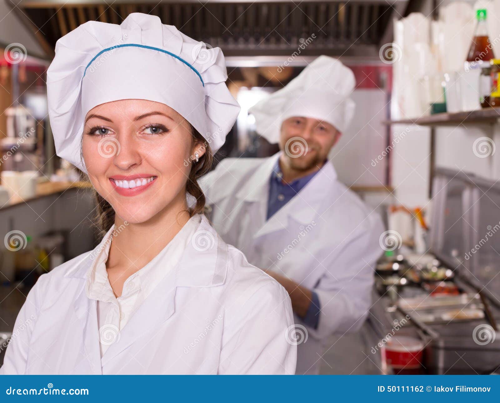 Chef and His Helper at Bistro Kitchen Stock Photo - Image of people ...