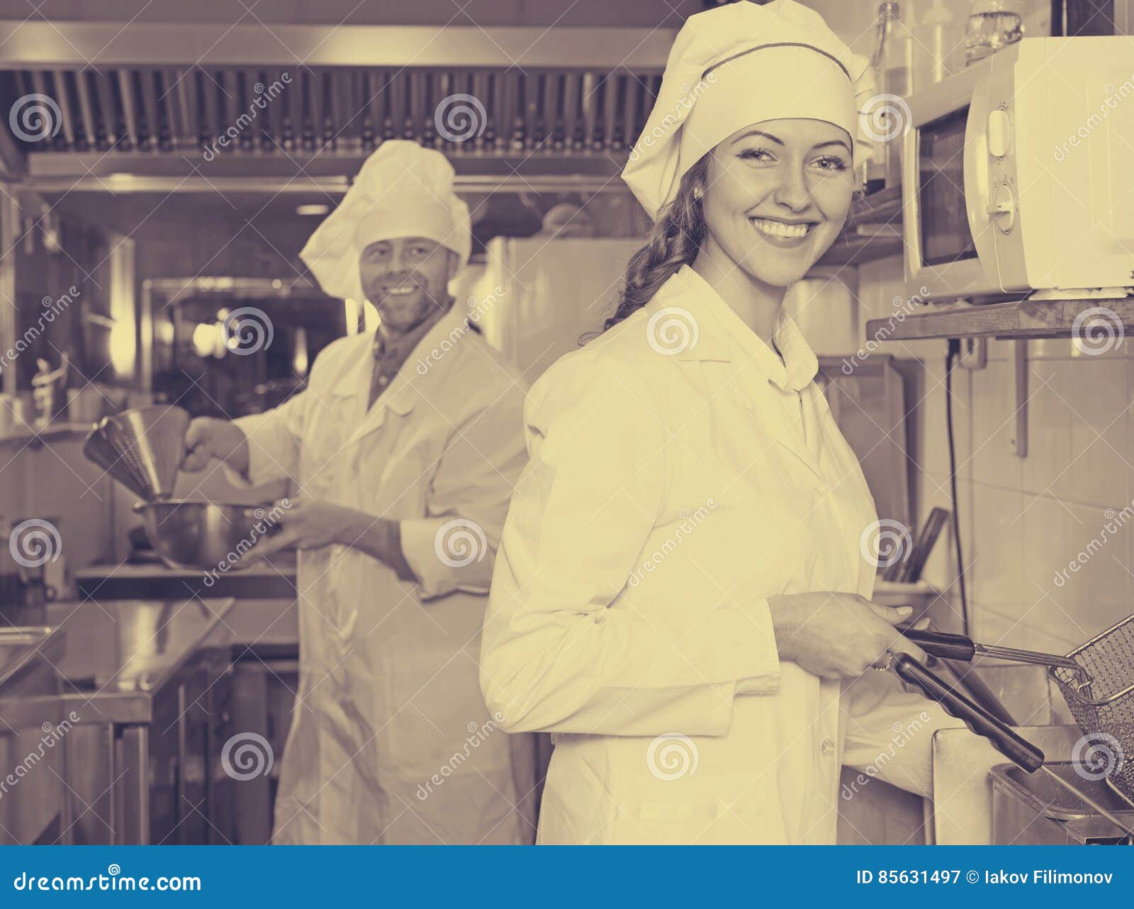 Chef and His Helper at Bistro Kitchen Stock Image - Image of cafeteria ...