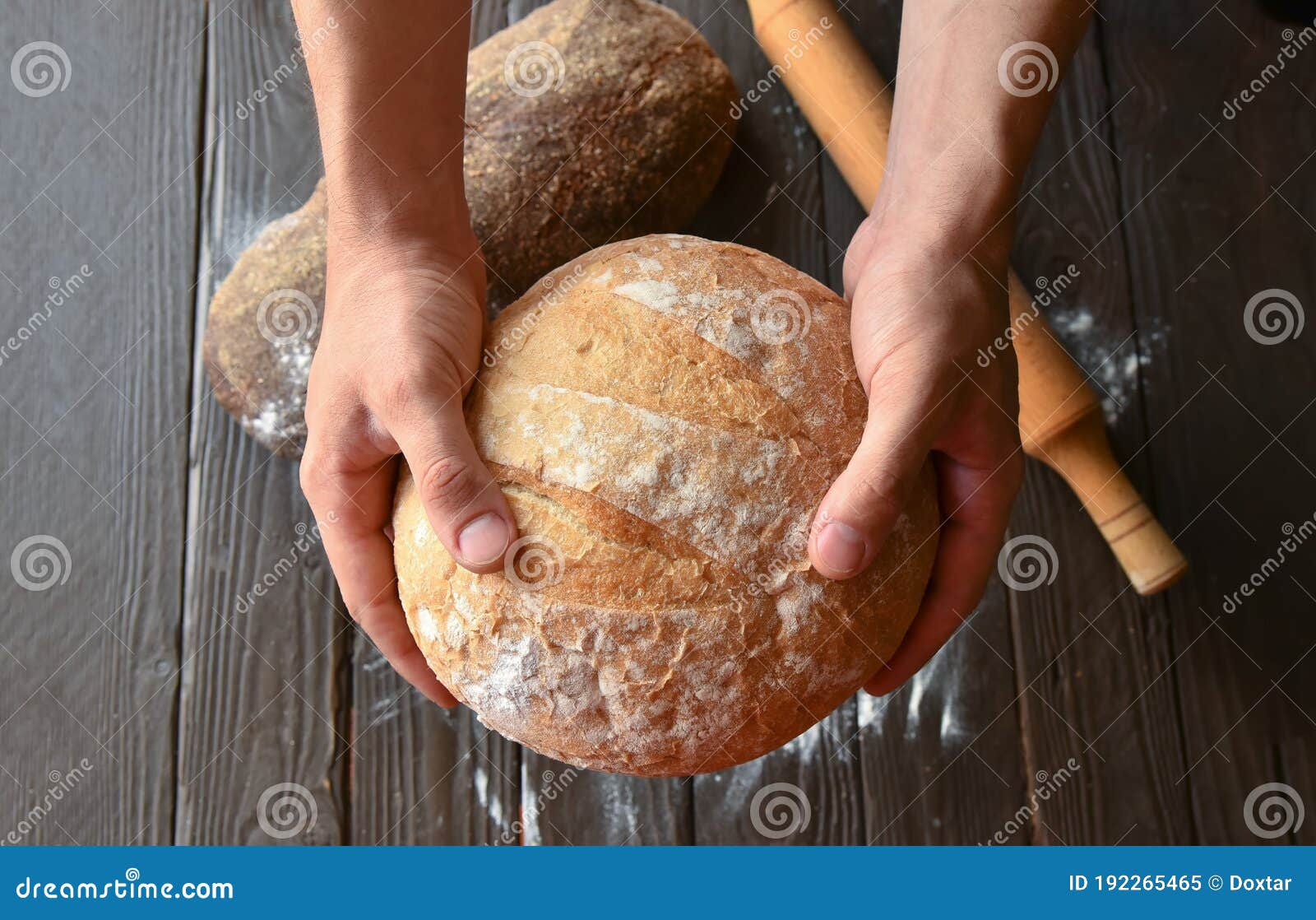 Chef is Holding the Bread Above the Kitchen Table Stock Image - Image ...