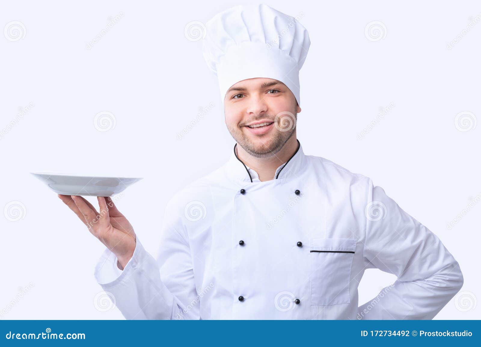 Chef Holding Empty Plate Posing in Studio on White Background Stock ...