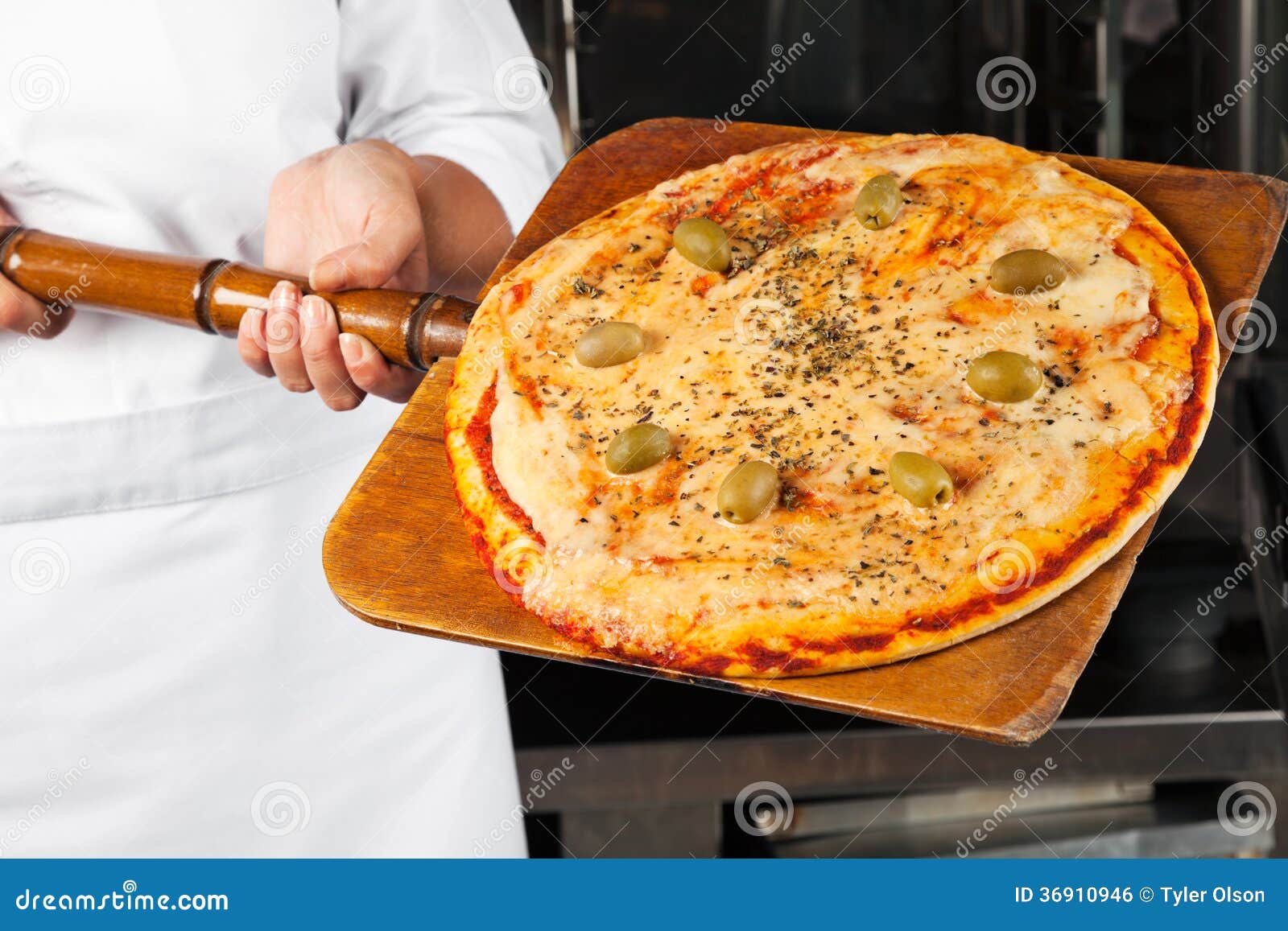 Chef Holding Pizza on Shovel Stock Photo - Image of kitchen, industry ...