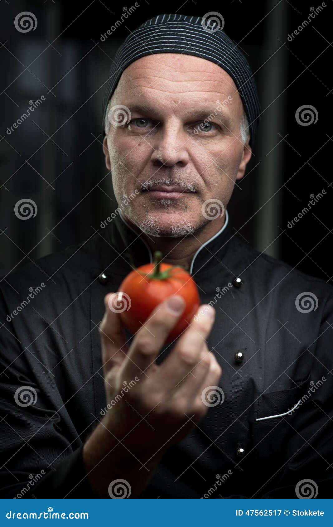 Chef holding a tomato stock image. Image of preparation - 47562517