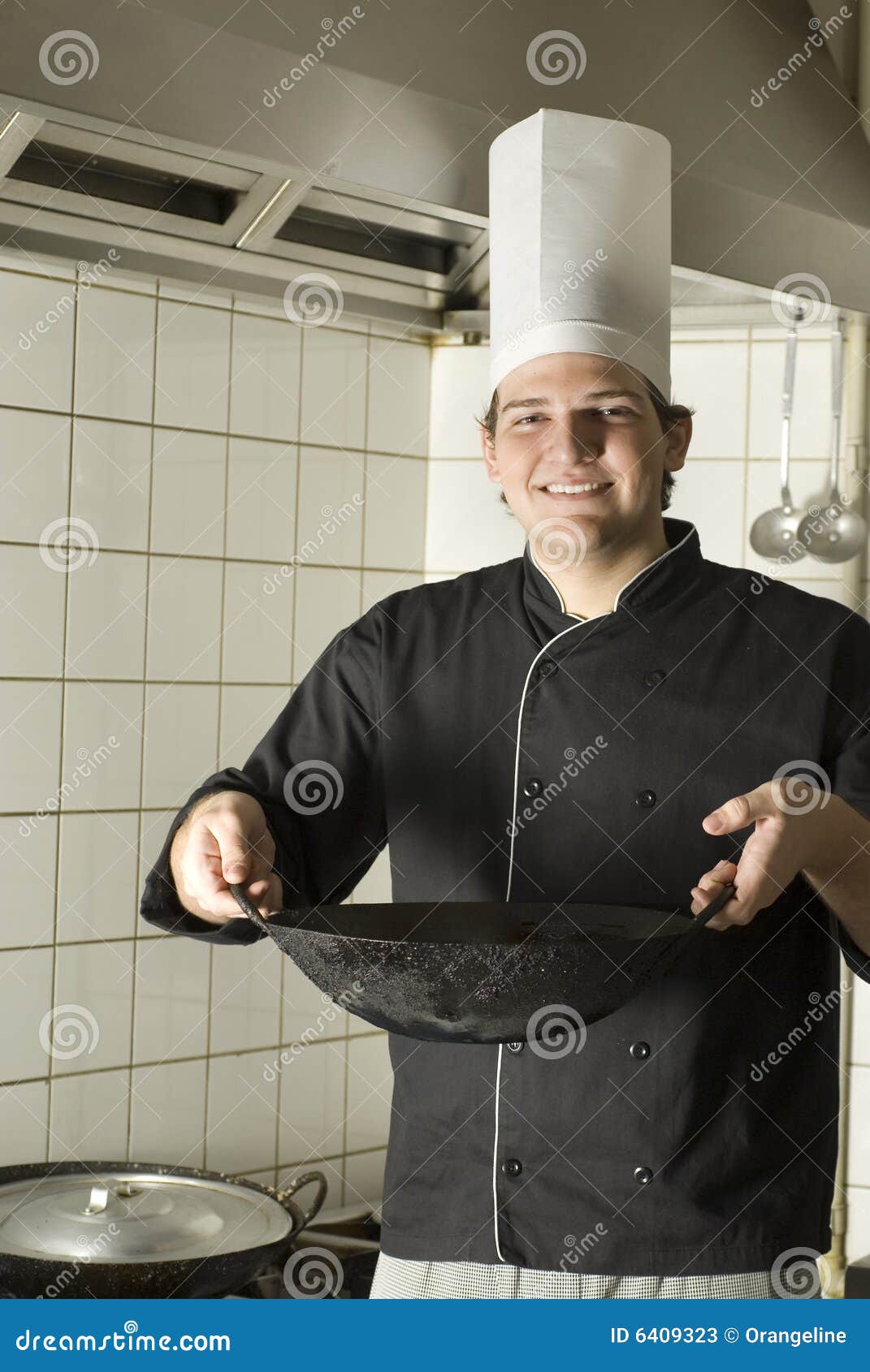 Chef Holding a Wok stock image. Image of professional - 6409323