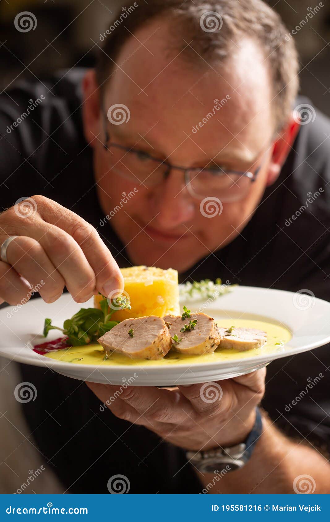 Chef in Hotel or Restaurant Kitchen Cooking only Hands. he is Working ...