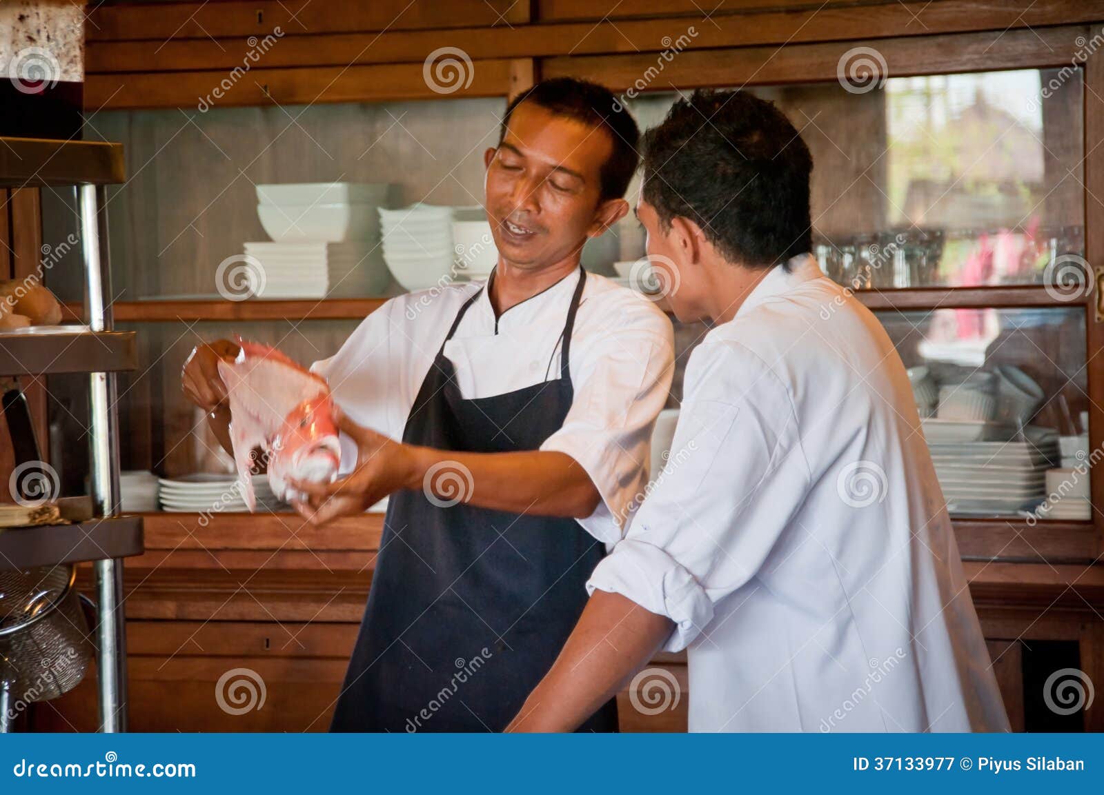 Chef Instructing Trainee in Restaurant Kitchen Editorial Photography ...