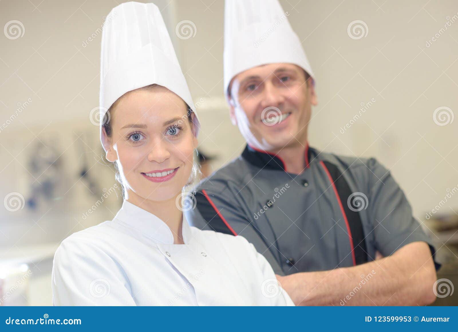Chef Instructing Trainee in Restaurant Kitchen Stock Image - Image of ...