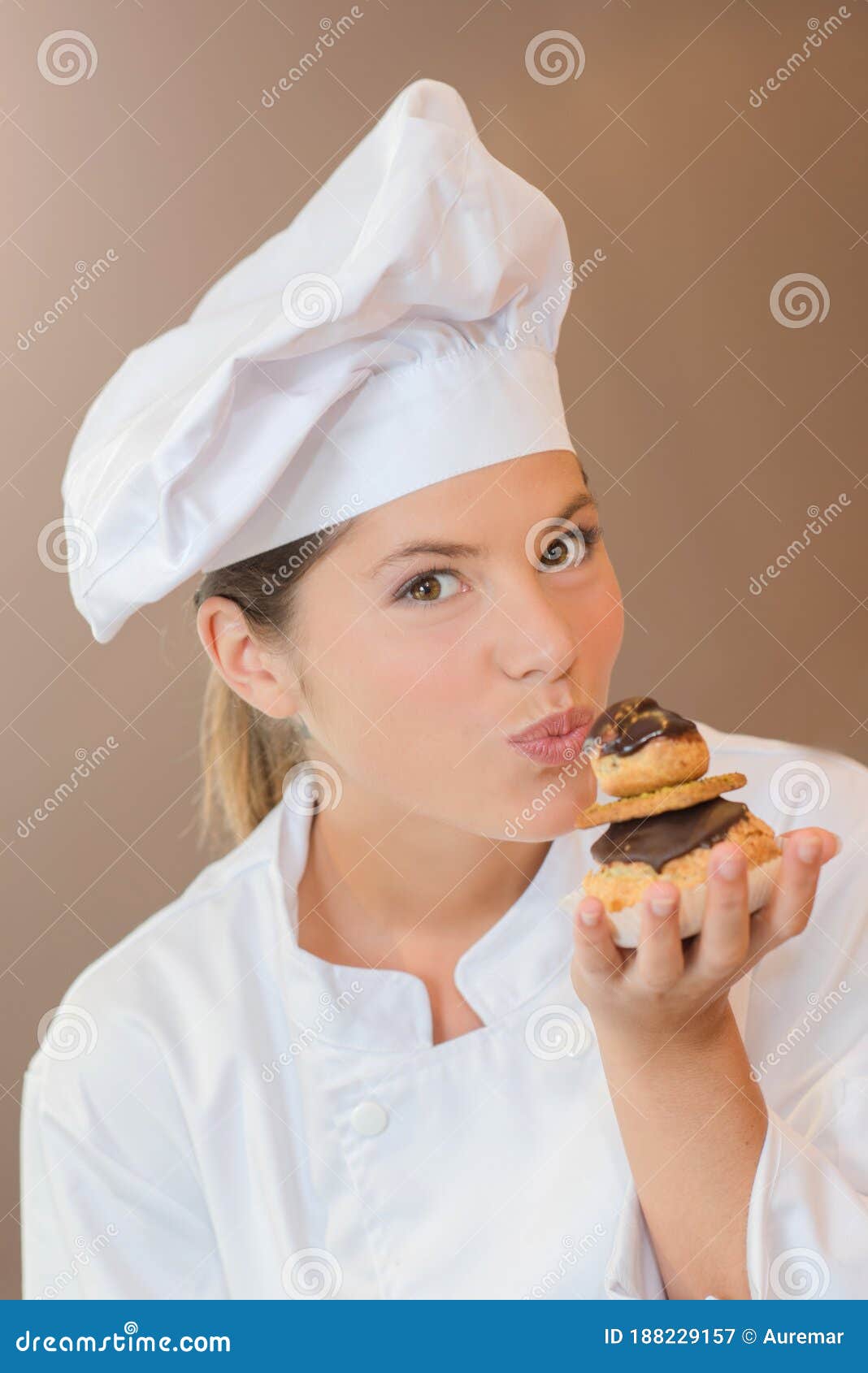 Chef kissing a profiterole stock image. Image of kiss - 188229157