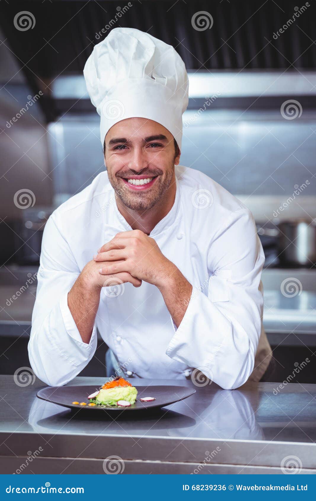 Chef Leaning on the Counter with a Dish Stock Photo - Image of plate ...