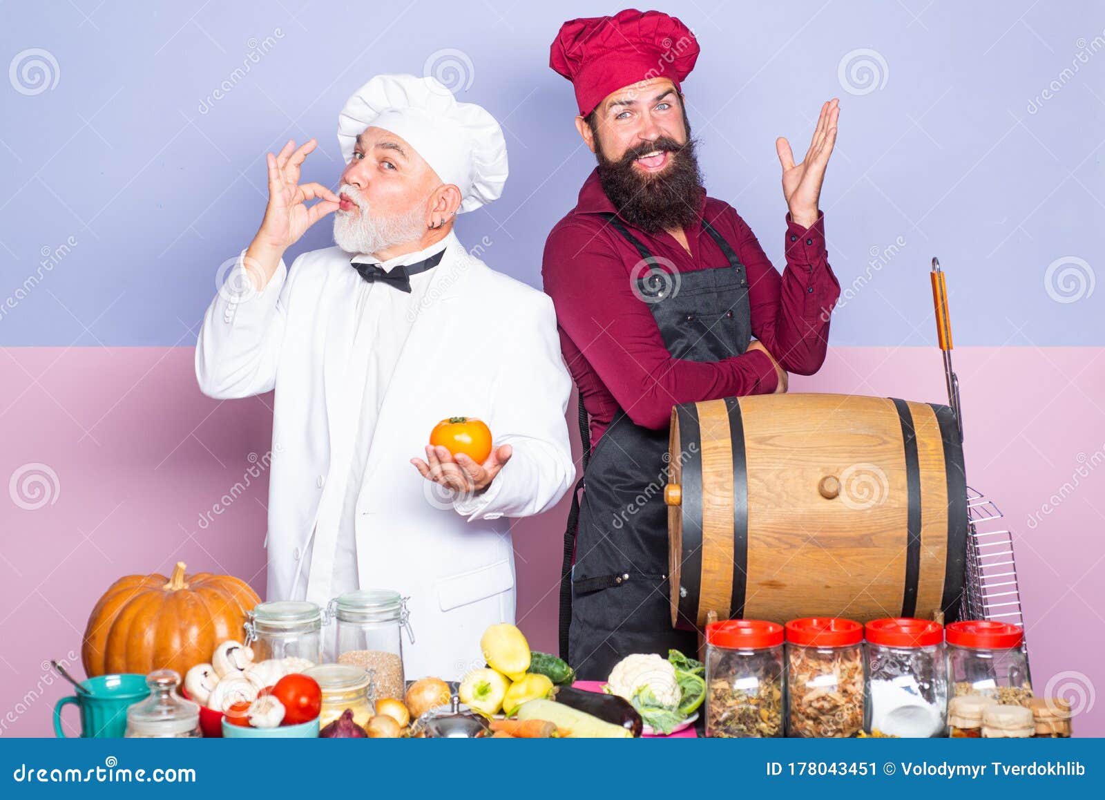 Chef Leaning on the Counter with a Dish in a Commercial Kitchen. Chef ...