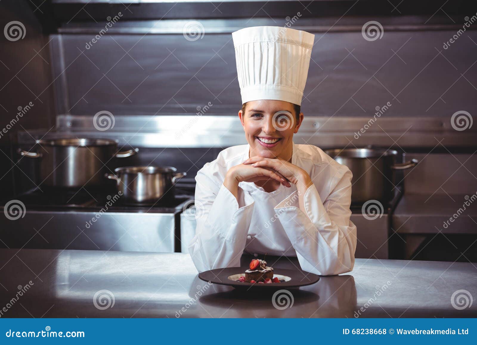 Chef Leaning on the Counter with a Dish Stock Photo - Image of dish ...