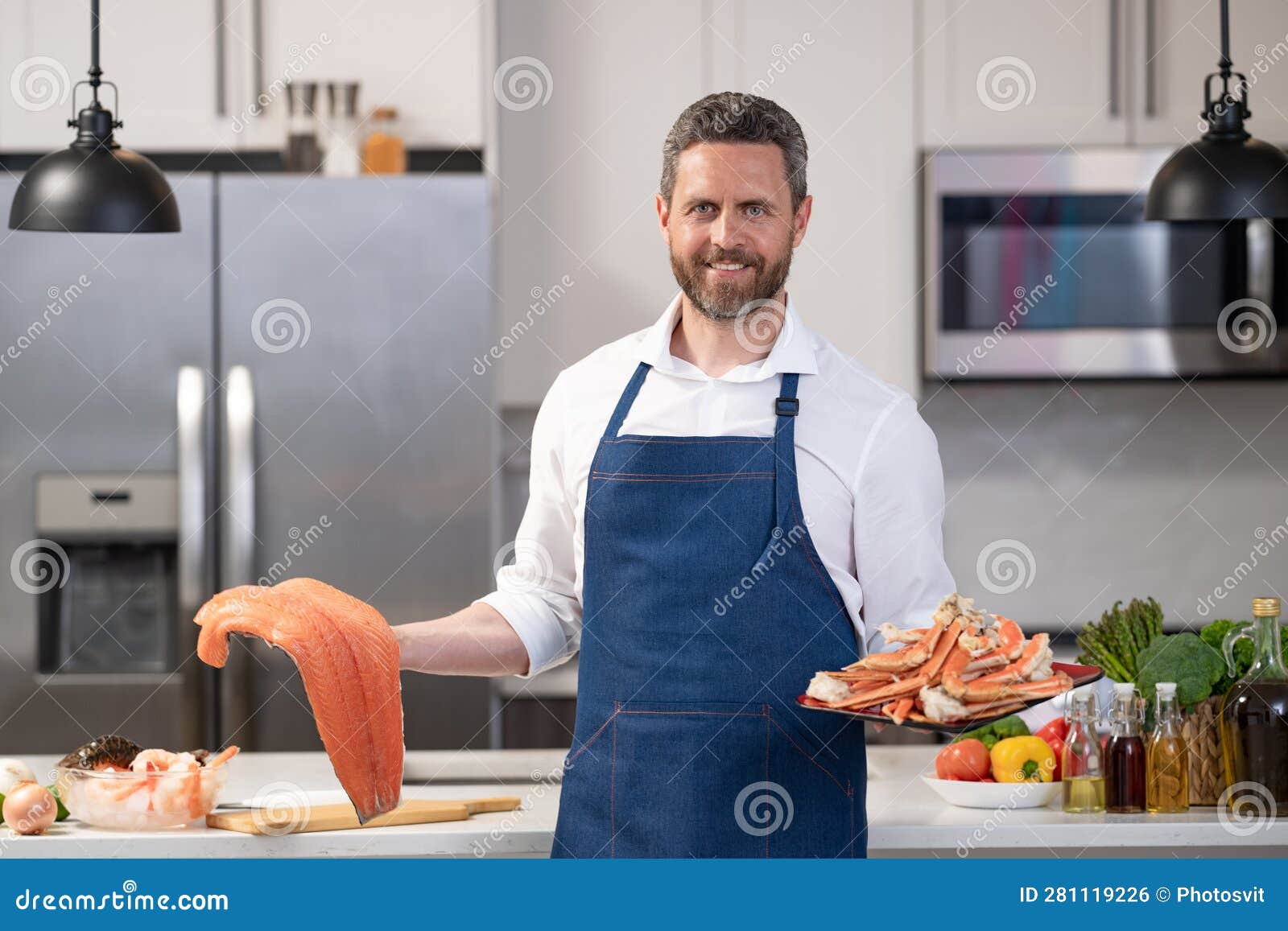 Chef with Lobster and Salmon Seafood. Chef Cooking Lobster and Salmon ...