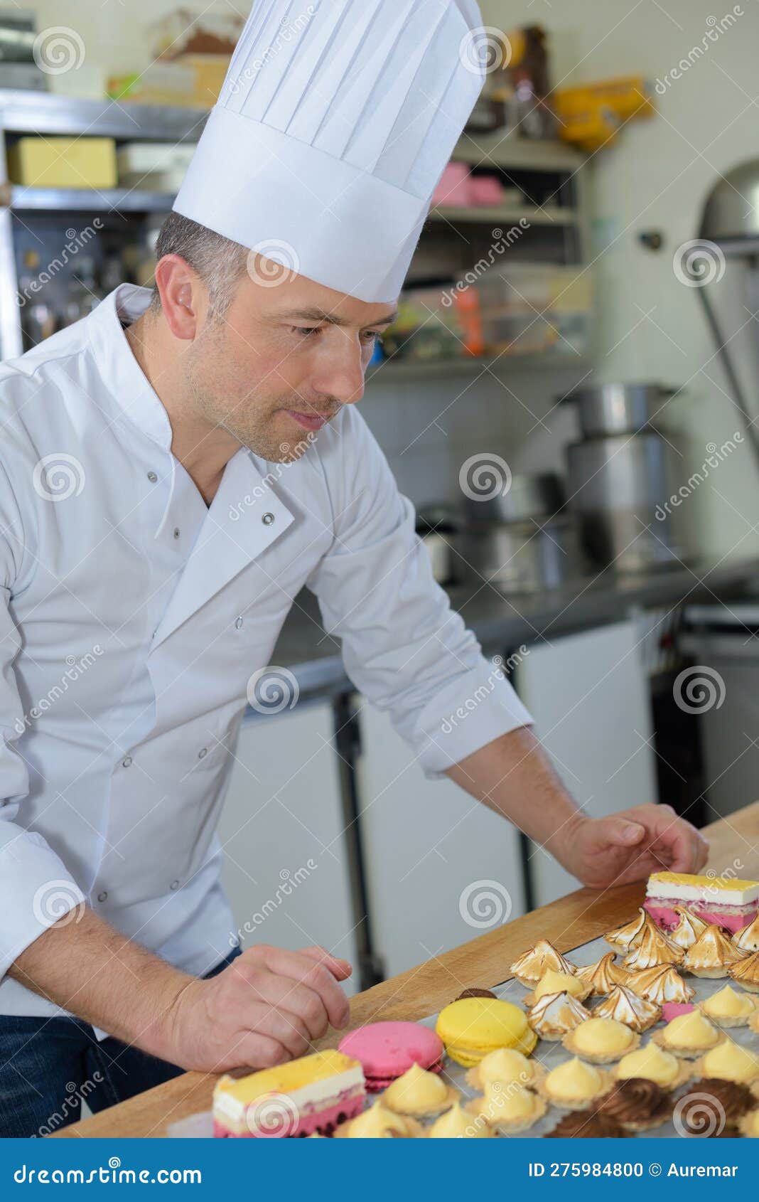 Chef looking at cakes stock photo. Image of food, pastry - 275984800