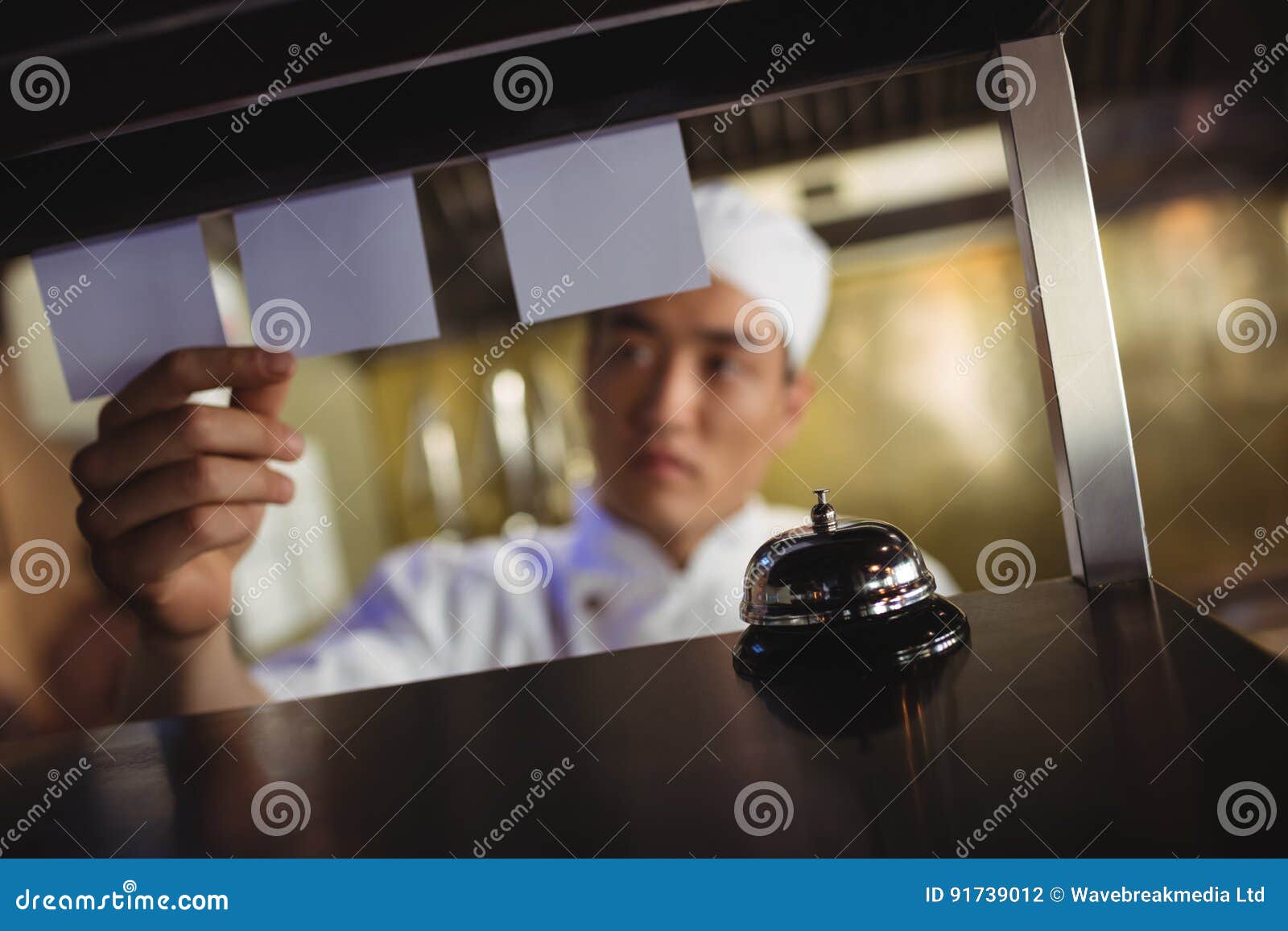 Chef Looking at an Order List in the Commercial Kitchen Stock Photo ...