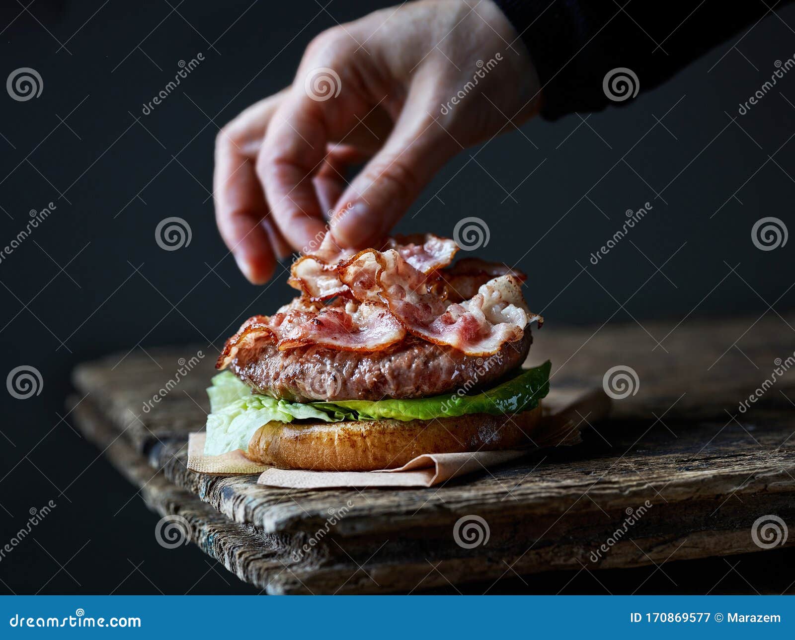 Chef making burger stock image. Image of hand, dark - 170869577