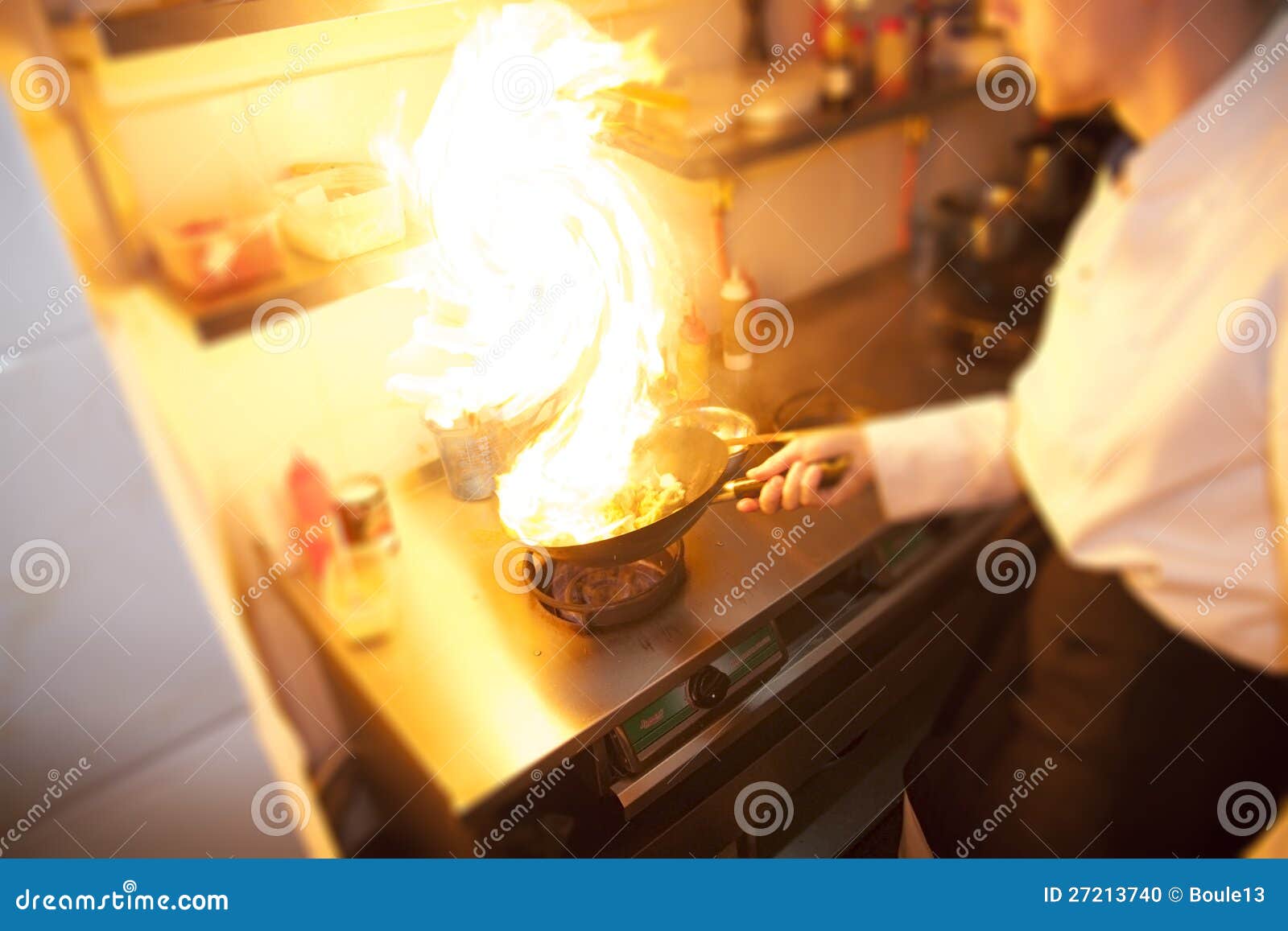 Chef is making flambe stock photo. Image of dishware - 27213740